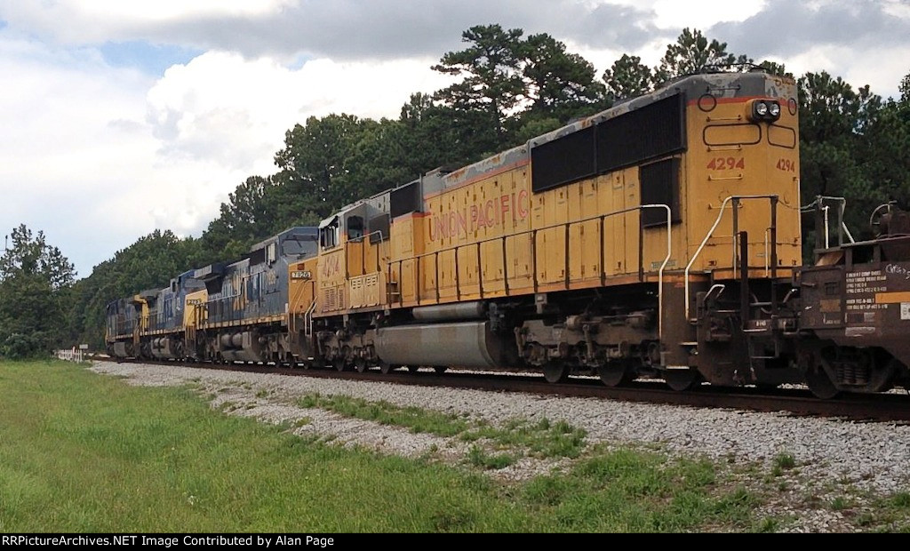 CSX AC44CW 244 leads sister-unit 279, C40-8W 7926, and UP SD70M 4294 to a stop